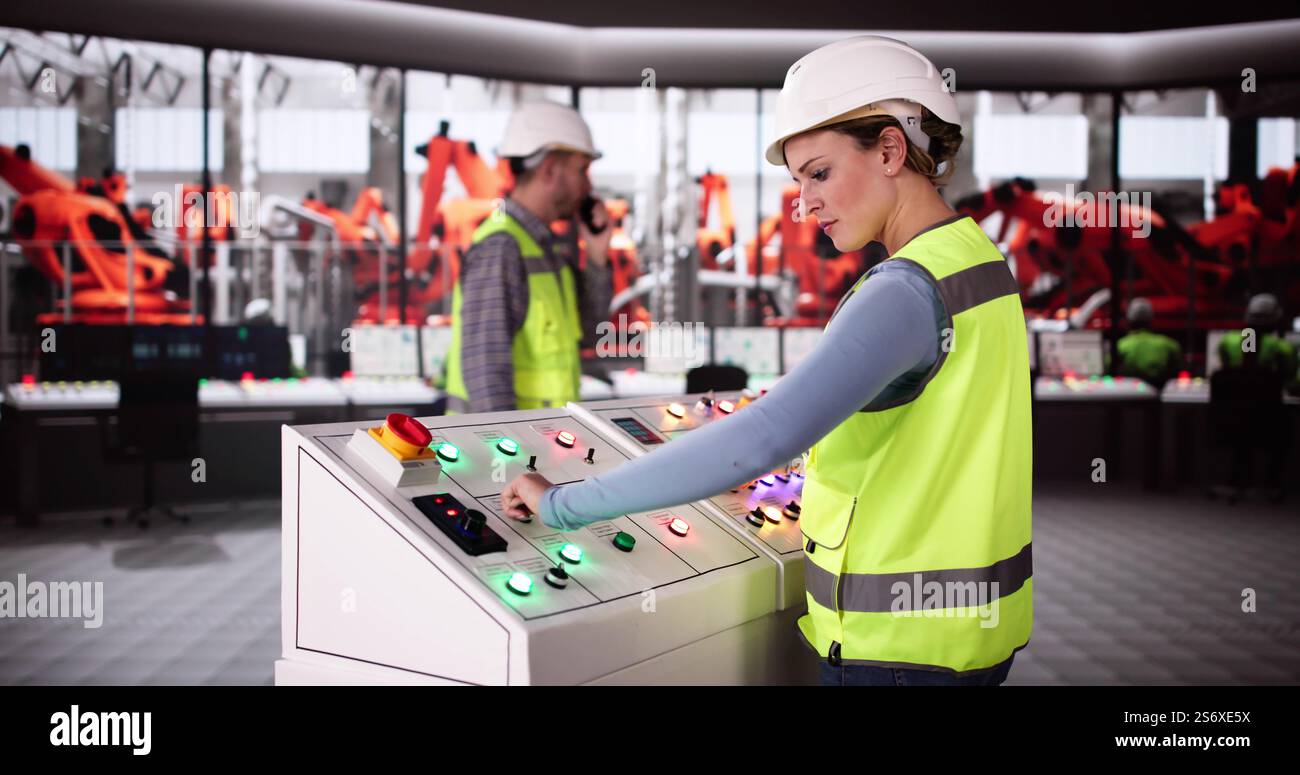 Worker In Automotive Car Factory Using Control Panel Stock Photo - Alamy
