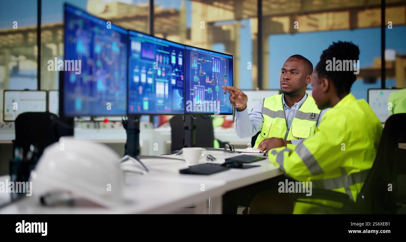 Automated Computer Technology At Industrial Plant. Checking Screens ...