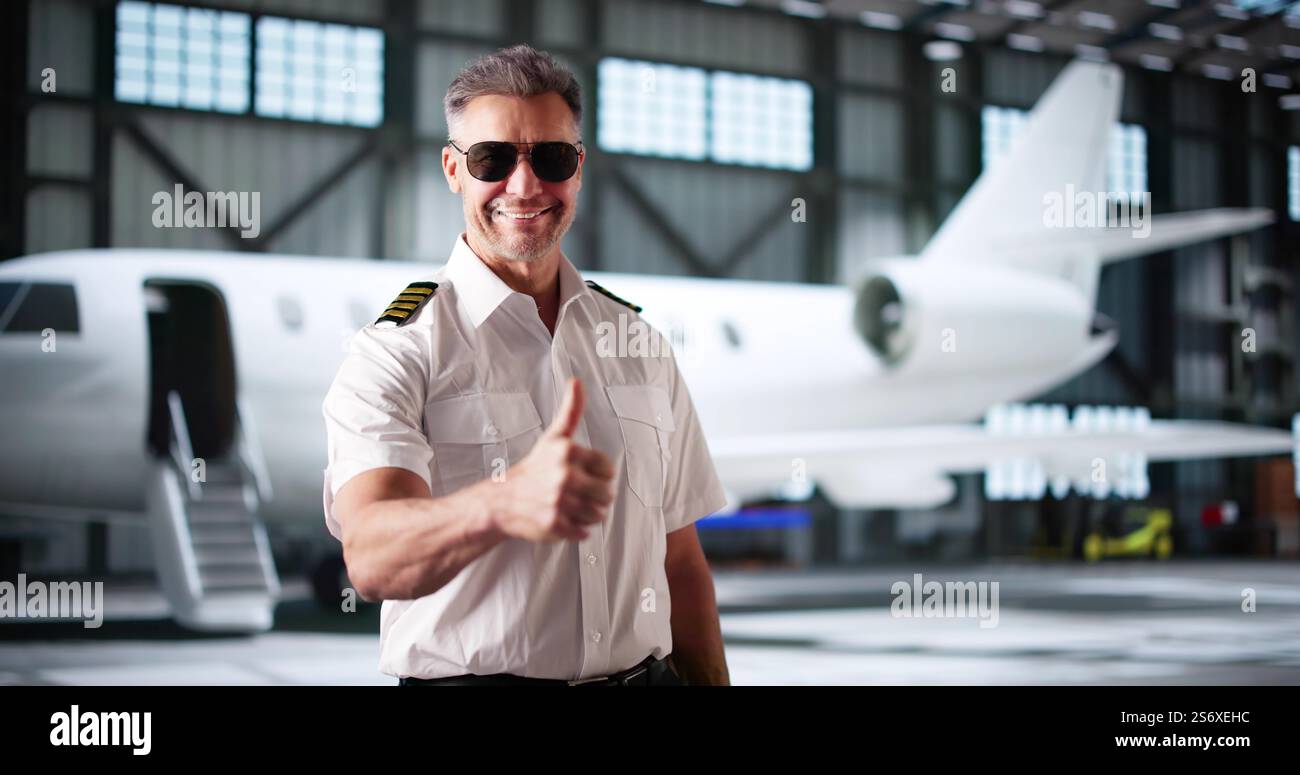 Private Jet Captain Pilot In Uniform Making Thumbs Up Gesture Stock ...