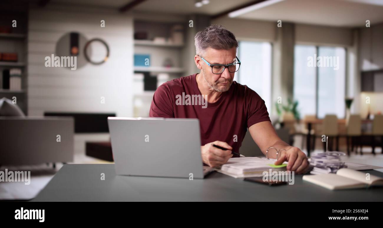 Man Doing Taxes And Family Budget On Computer Stock Photo - Alamy