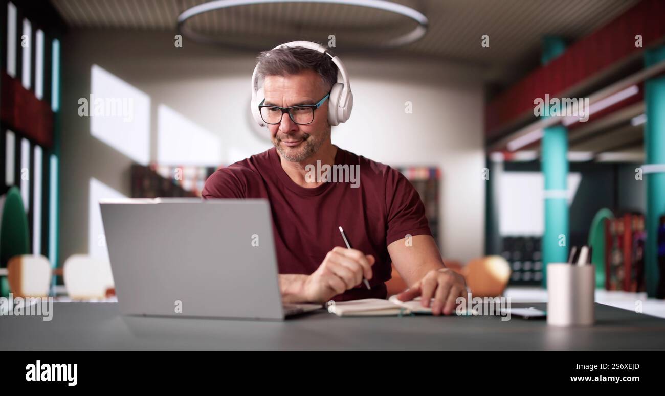 Online Virtual Webinars On Laptop Computer. Happy Man With Headphones ...