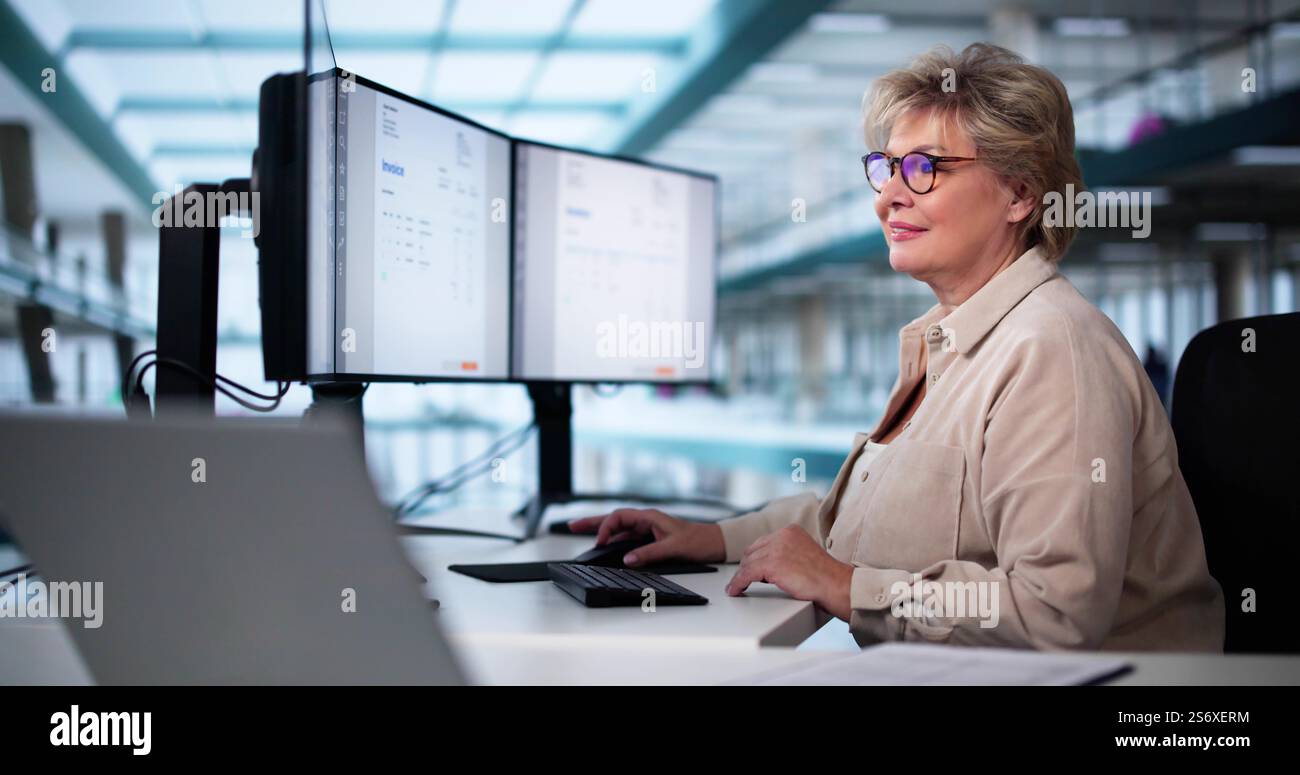 Accountant Using E Invoice Software At Computer In Office Stock Photo ...