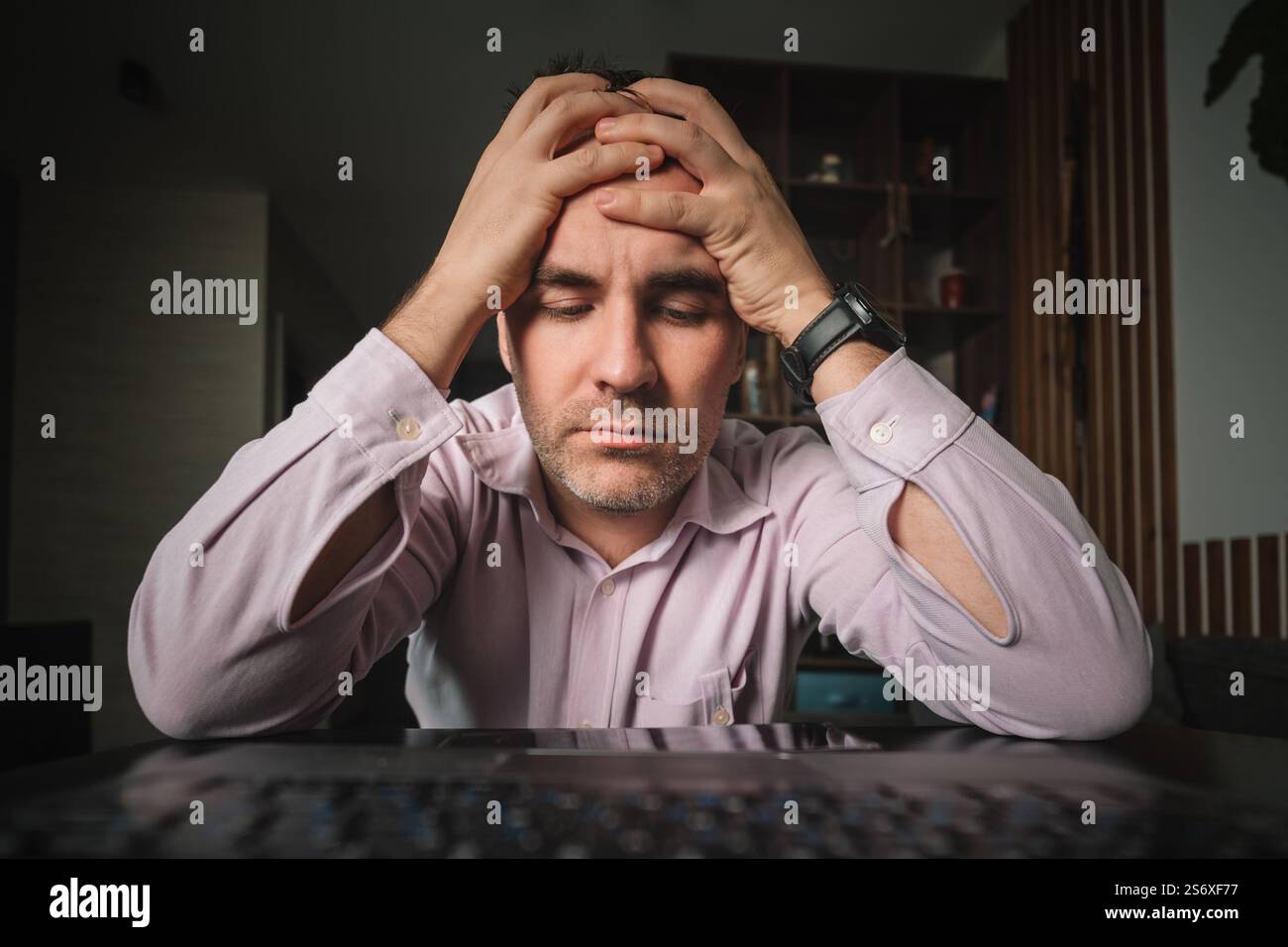 Businessman office working holding sore head pain from desk working and ...