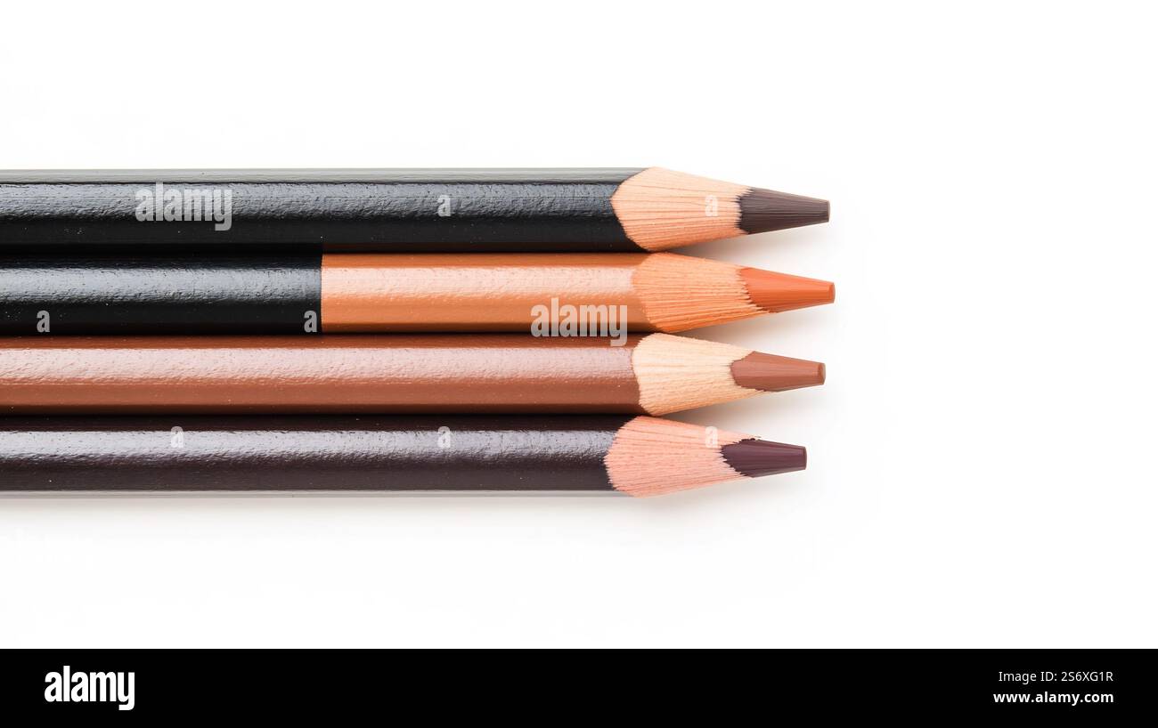 Set of assorted colored pencils of various shades arranged in a row on ...