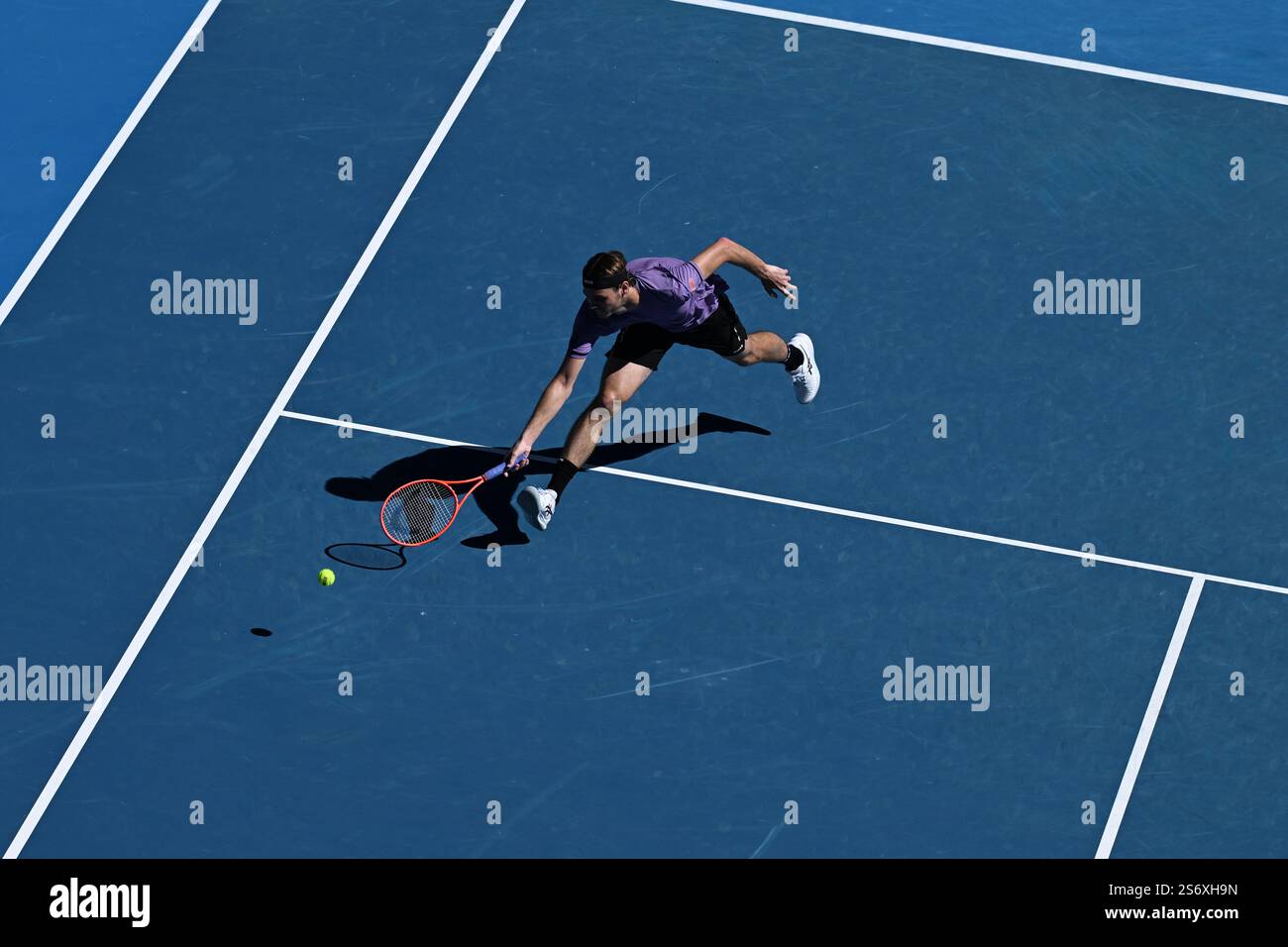 Melbourne, Australia. 18th Jan, 2025. Taylor Fritz of USA returns during his round three match ...