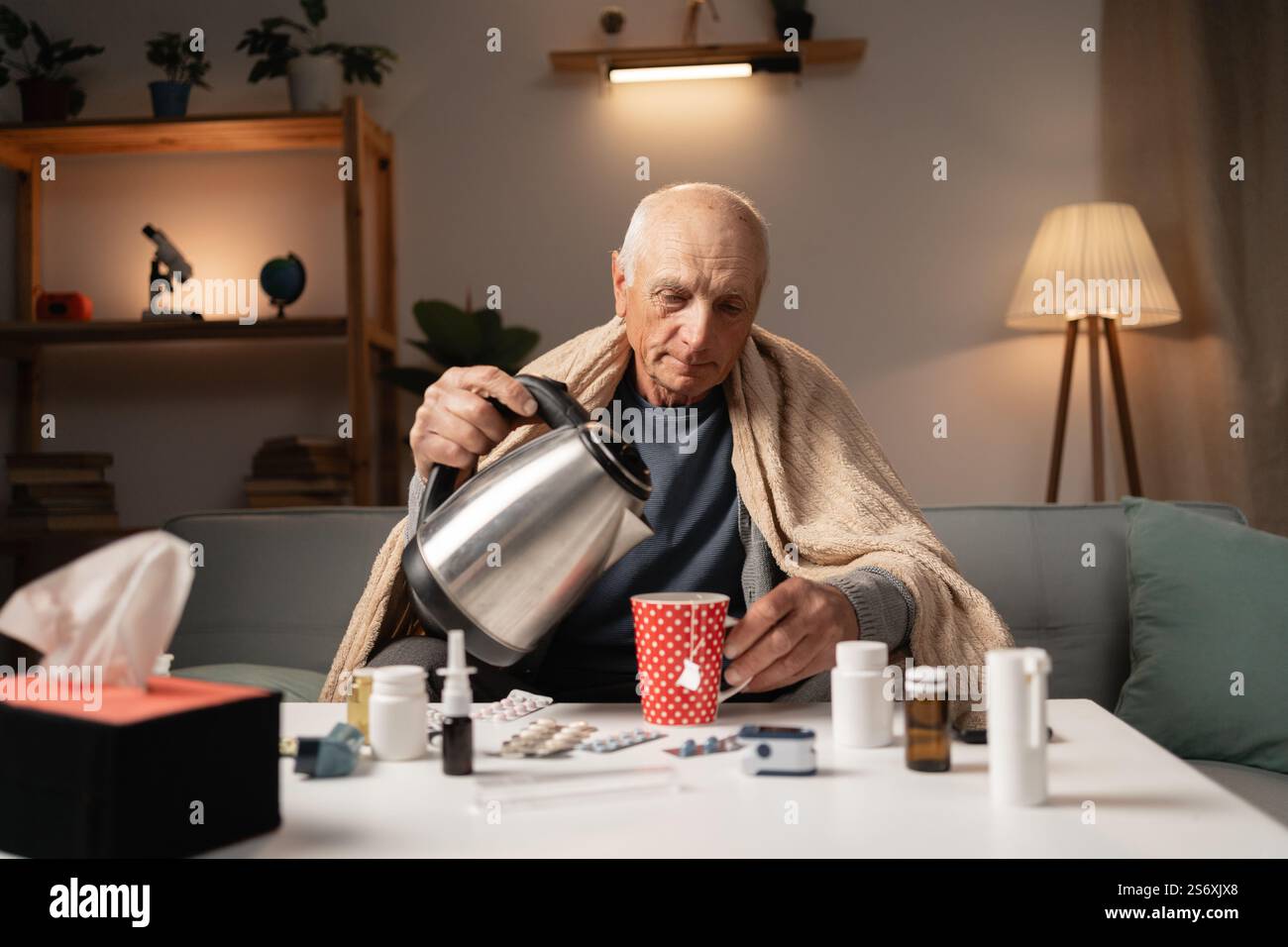 Senor man pouring boiling water into cup preparing hot drink elderly ...