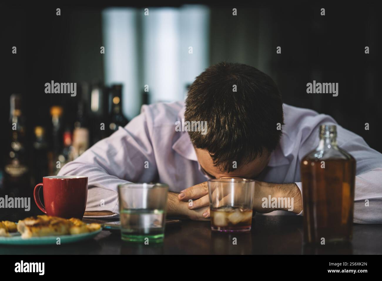 Drunk person sleep at bar have a alcohol drink Stock Photo - Alamy