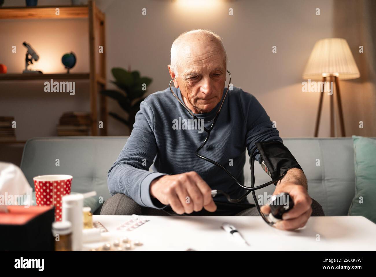 Senior man measuring blood pressure at home. measure blood pressure ...