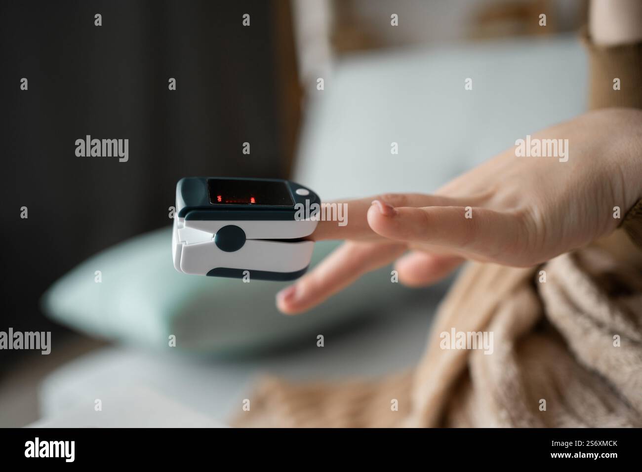 Woman uses oximeter measure hi-res stock photography and images - Alamy