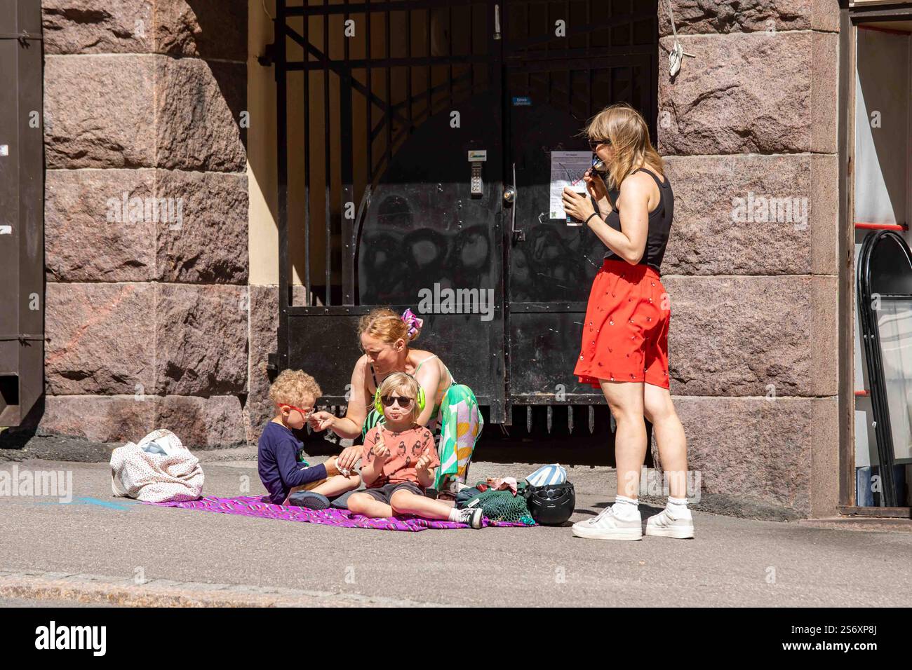 Picnic on sidewalk at Viides linja 7 during Kallio Block Party 2024 in ...