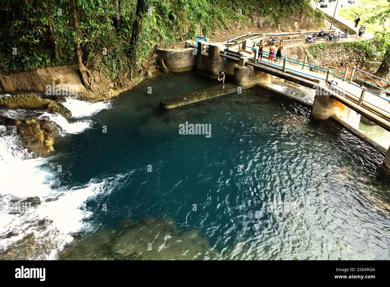 A waterfall and dam at limestone caves of Waikelo Sawah, a rare water ...
