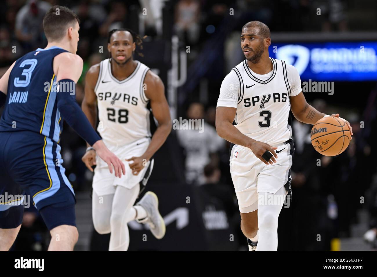 San Antonio Spurs' Chris Paul, right, drives against Memphis Grizzlies ...