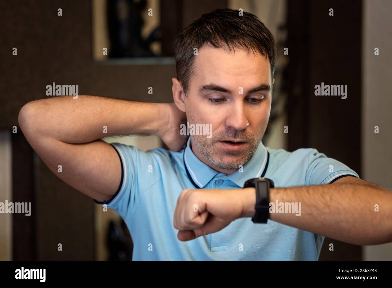 shocked businessman with hand watch. man checking time. wristwatch on ...