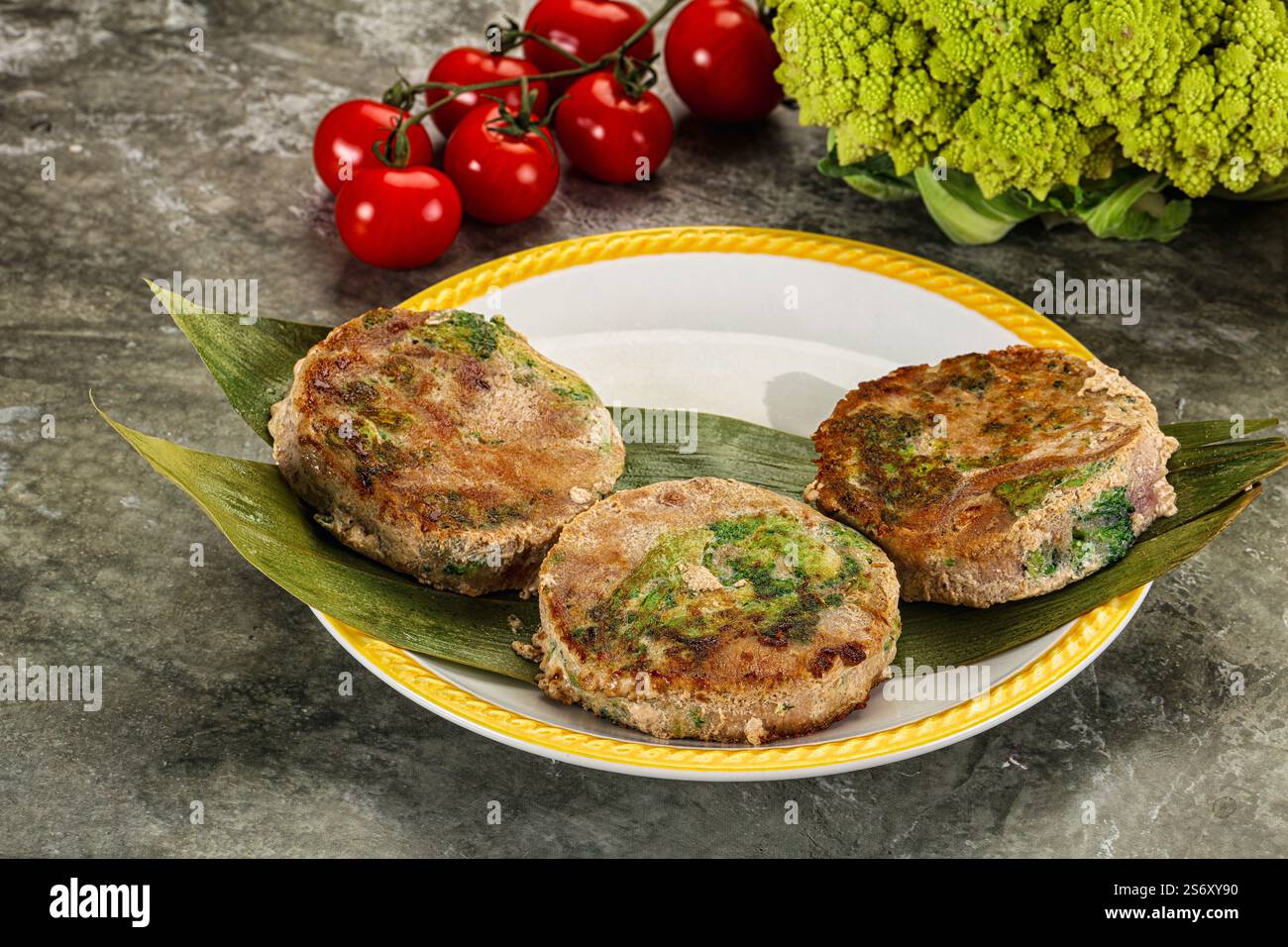 Roasted tuna medallion with broccoli cabbage Stock Photo - Alamy