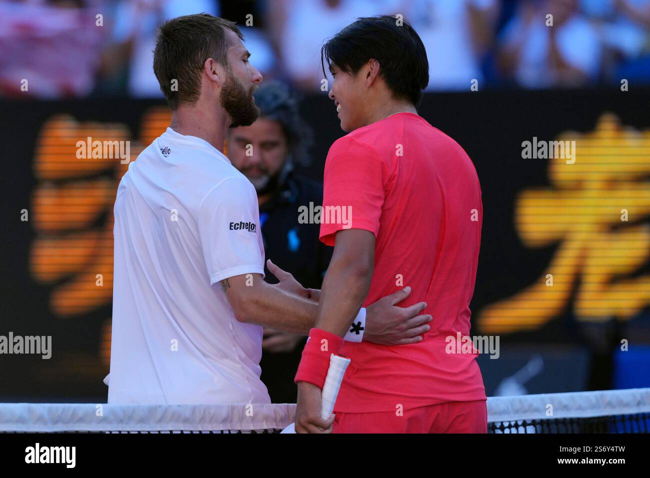 Learner Tien of the U.S. is congratulated by Corentin Moutet, left, of ...