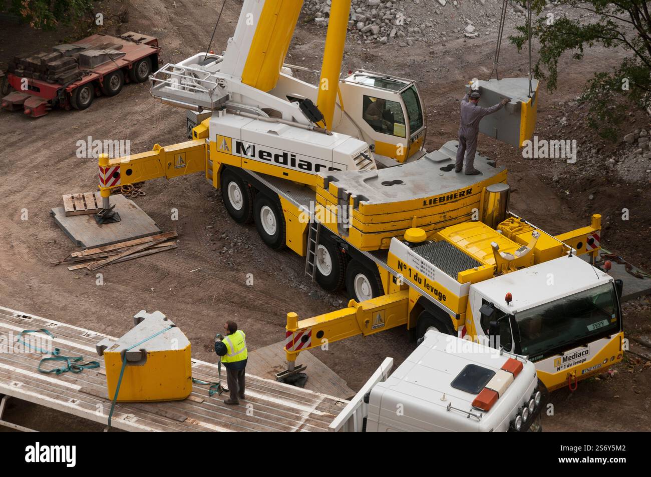 Assembly of counterweights on a liebherr mobile crane Stock Photo - Alamy