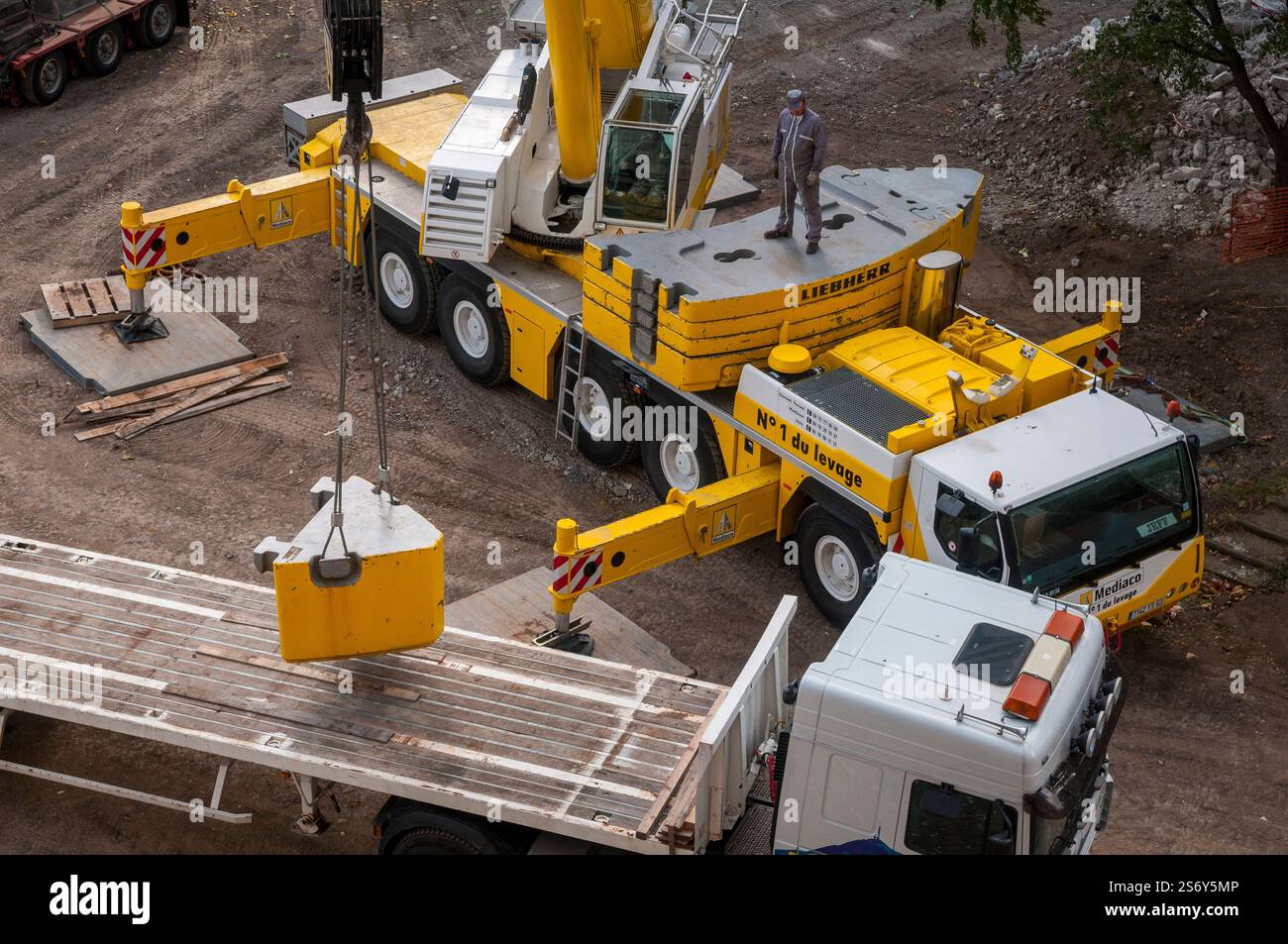 Assembly of counterweights on a liebherr mobile crane Stock Photo - Alamy