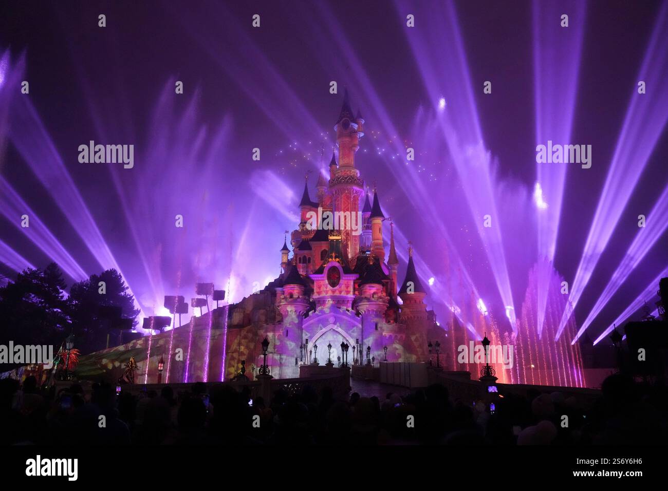 A light show is projected on the castle of Sleeping Beauty as fireworks ...