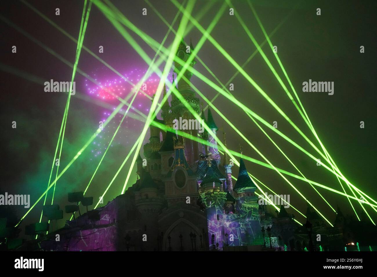 A light show is projected on the castle of Sleeping Beauty as fireworks ...
