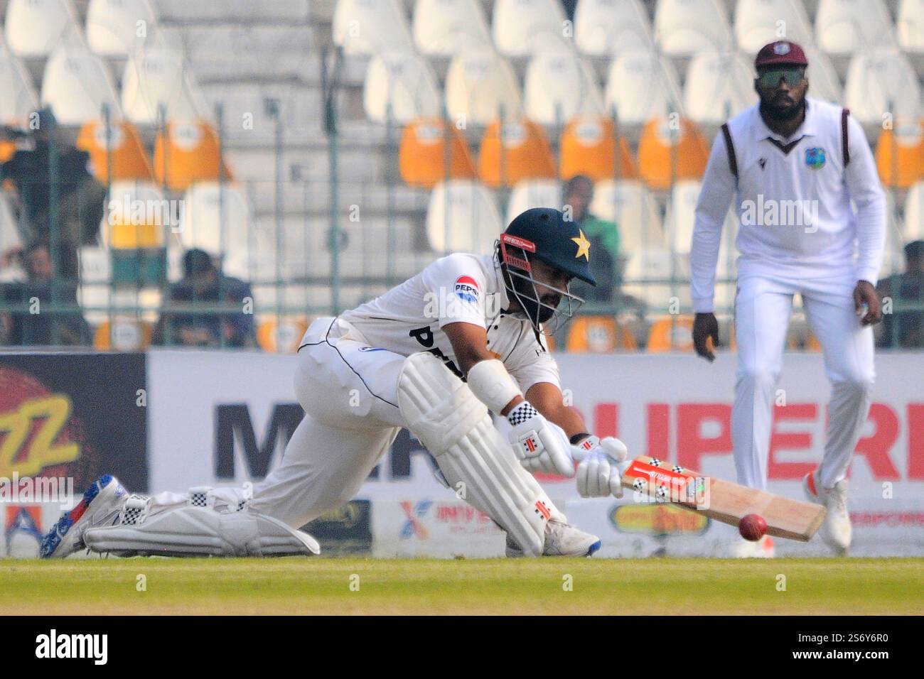 Pakistan's Saud Shakeel, center, plays a shot during the day two of the ...
