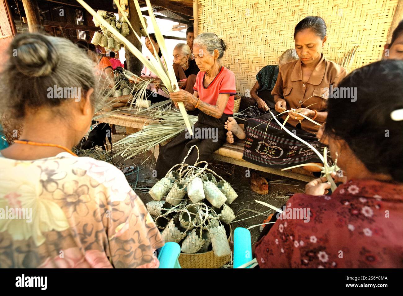 Women crafting souvenir bags for visitors, before the pre-marriage ...