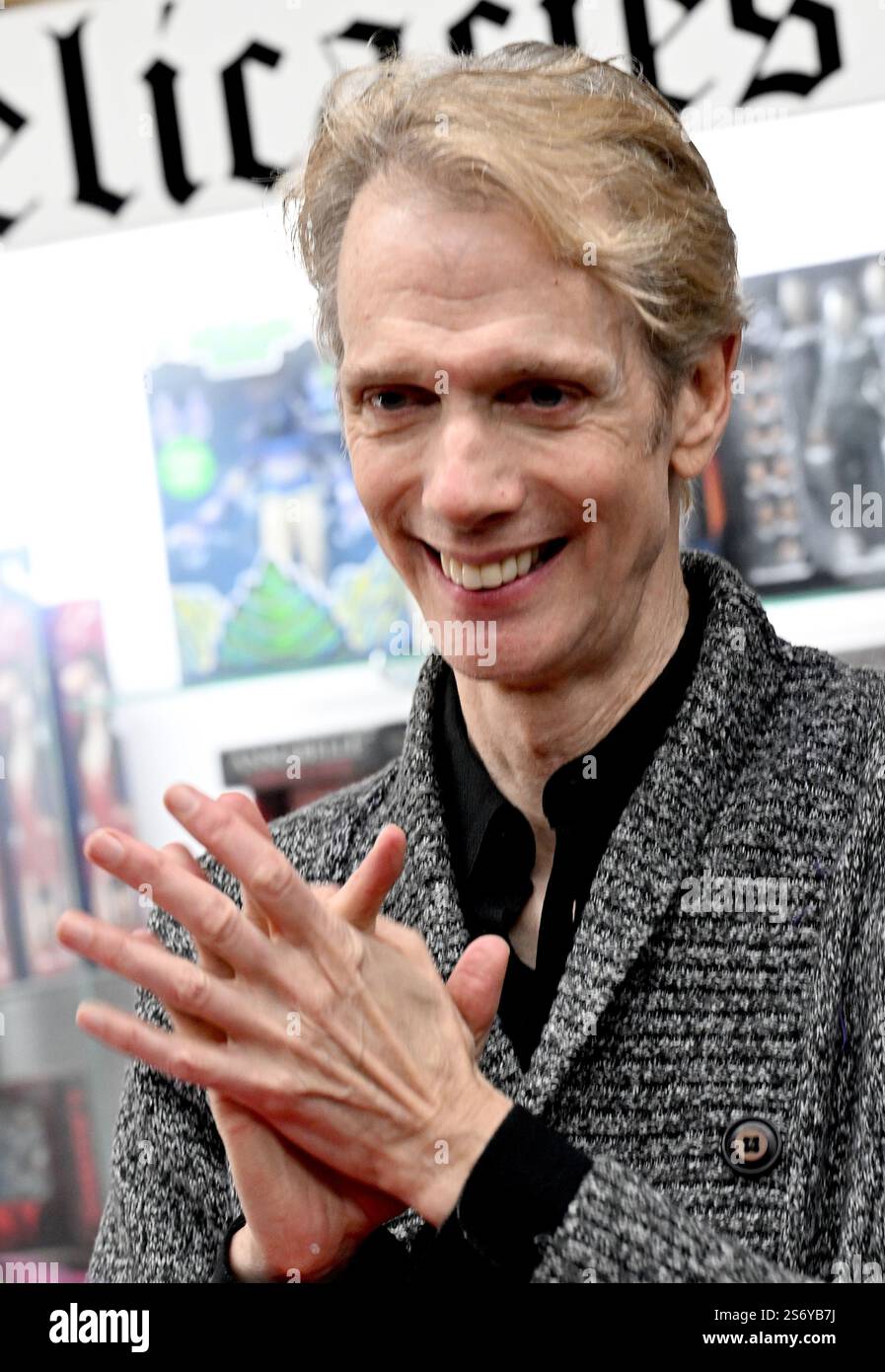 Actor Doug Jones talks to fans as he signs FUNKO Pop Doll from both ...