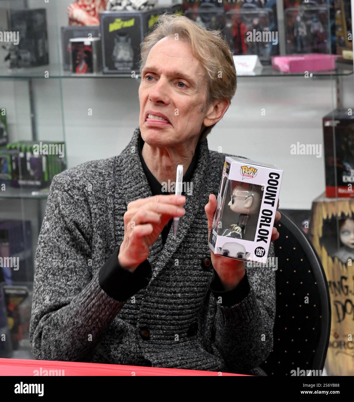 Actor Doug Jones signs a FUNKO Pop Doll of Count Orlock from "Nosferatu ...