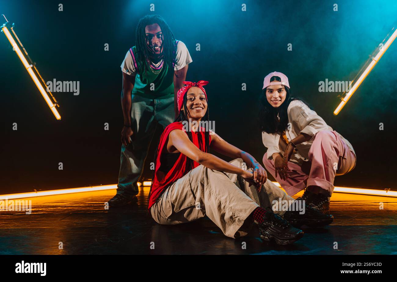 Group of hip hop dancer dancing together in a moody studio with tube ...