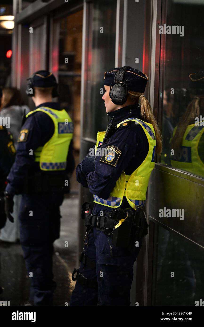 Stockholm, Uppland, Sweden. January 1 2025. Police and security guards ...
