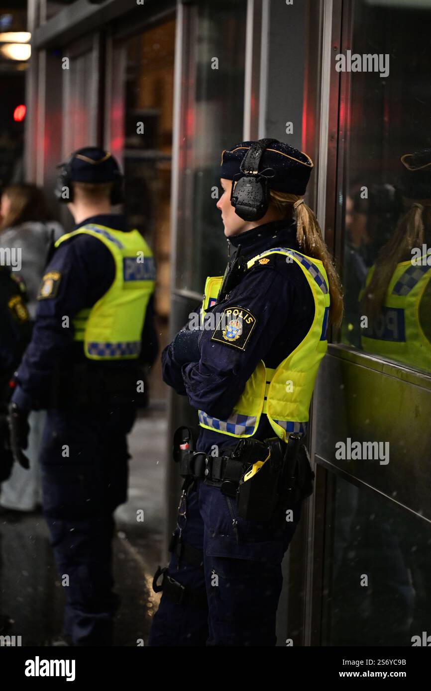 Stockholm, Uppland, Sweden. January 1 2025. Police and security guards ...
