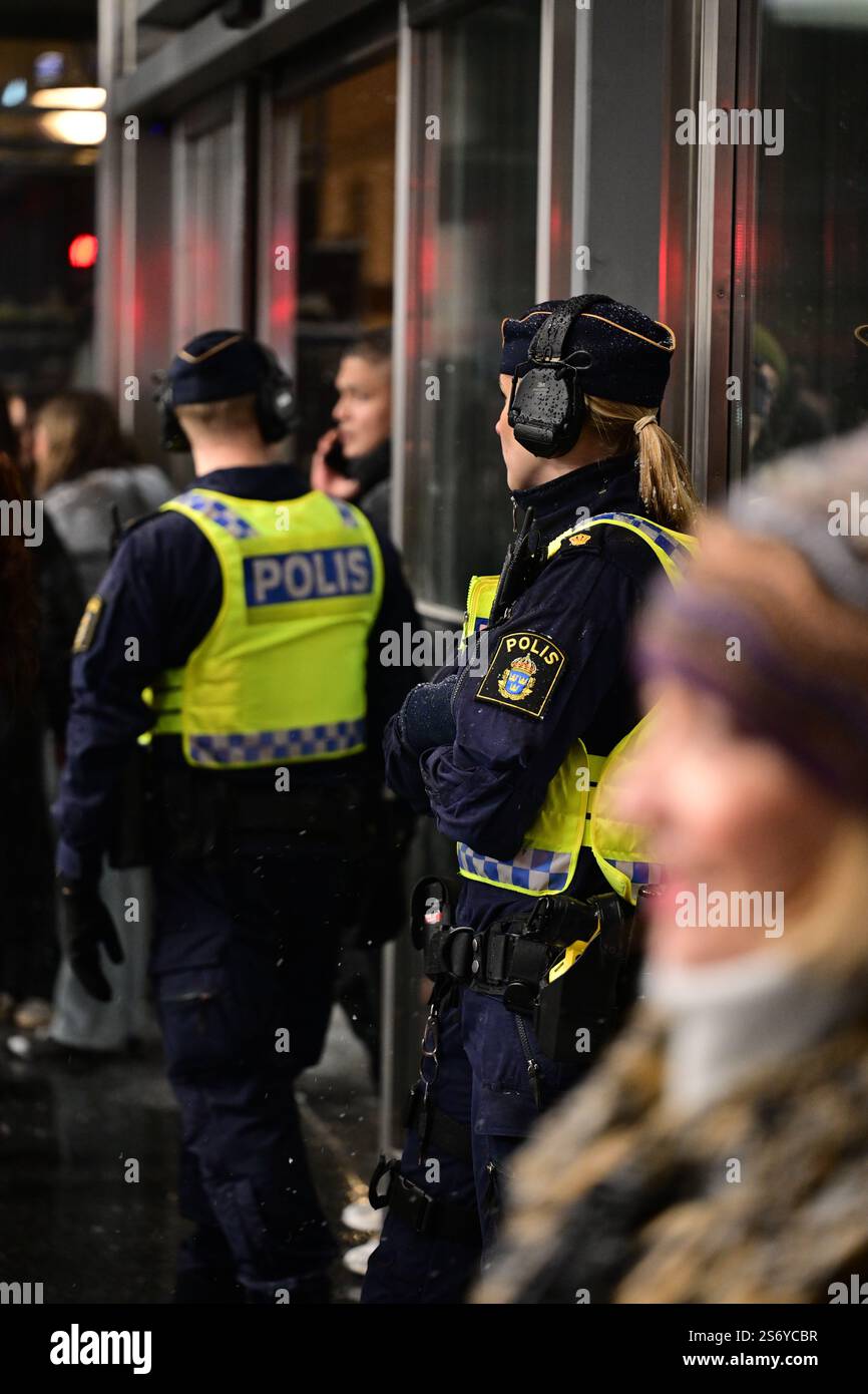 Stockholm, Uppland, Sweden. January 1 2025. Police and security guards ...