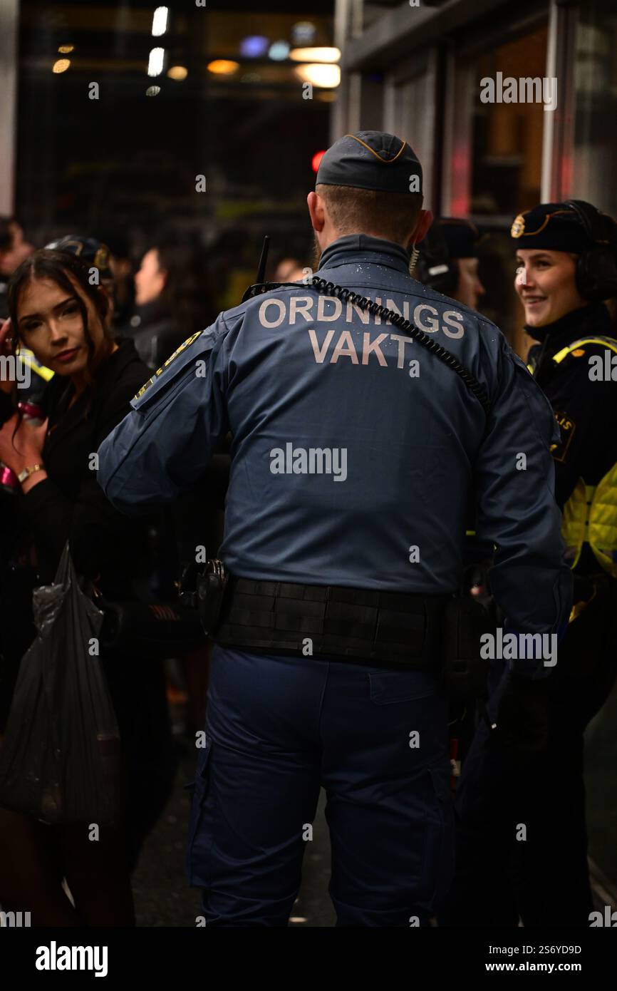Stockholm, Uppland, Sweden. January 1 2025. Police and security guards ...
