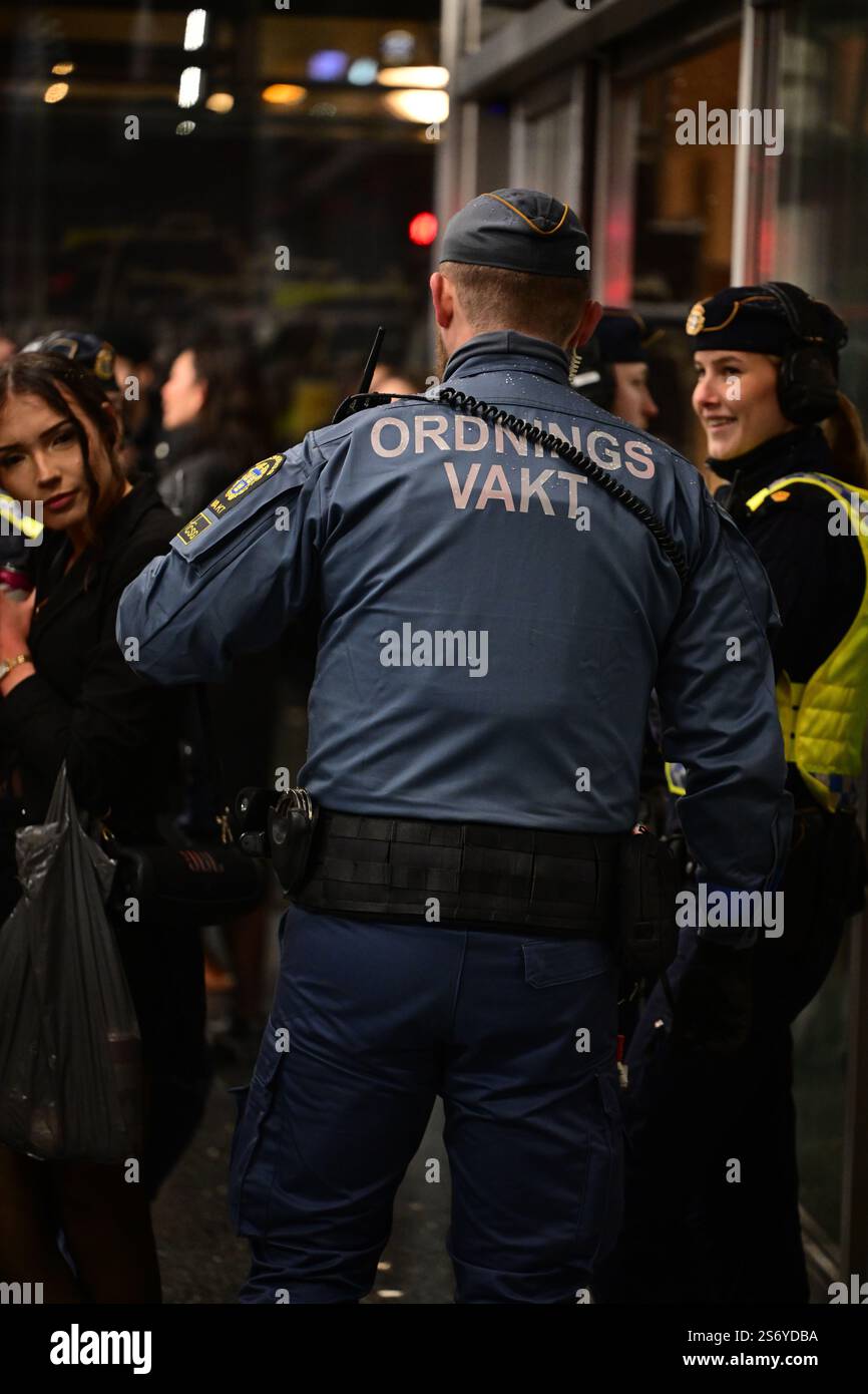 Stockholm, Uppland, Sweden. January 1 2025. Police and security guards ...