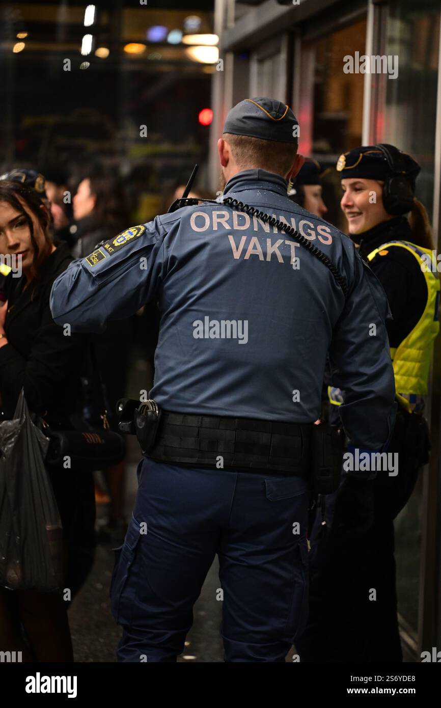 Stockholm, Uppland, Sweden. January 1 2025. Police and security guards ...