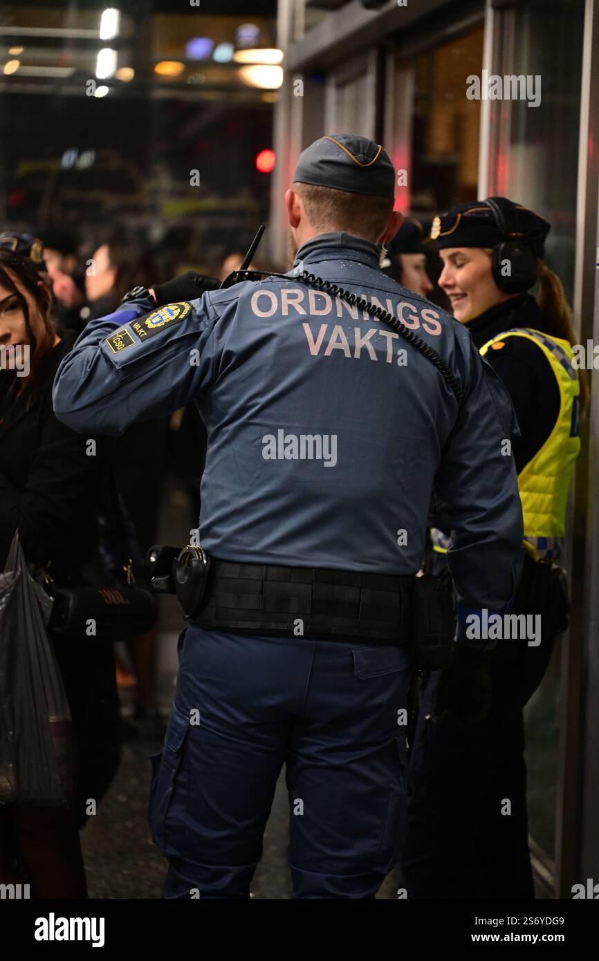 Stockholm, Uppland, Sweden. January 1 2025. Police and security guards ...