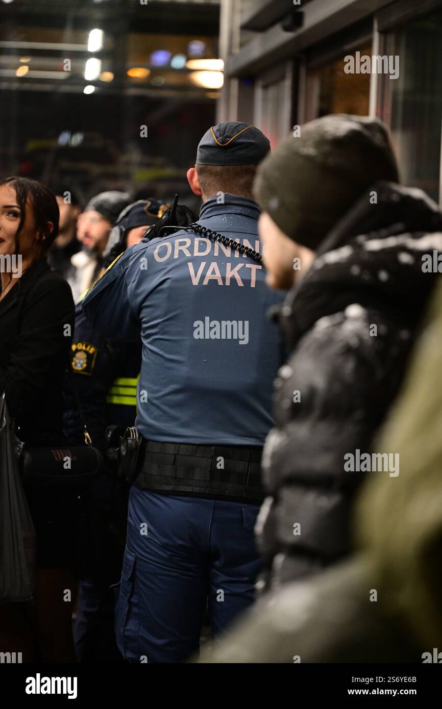 Stockholm, Uppland, Sweden. January 1 2025. Police and security guards ...