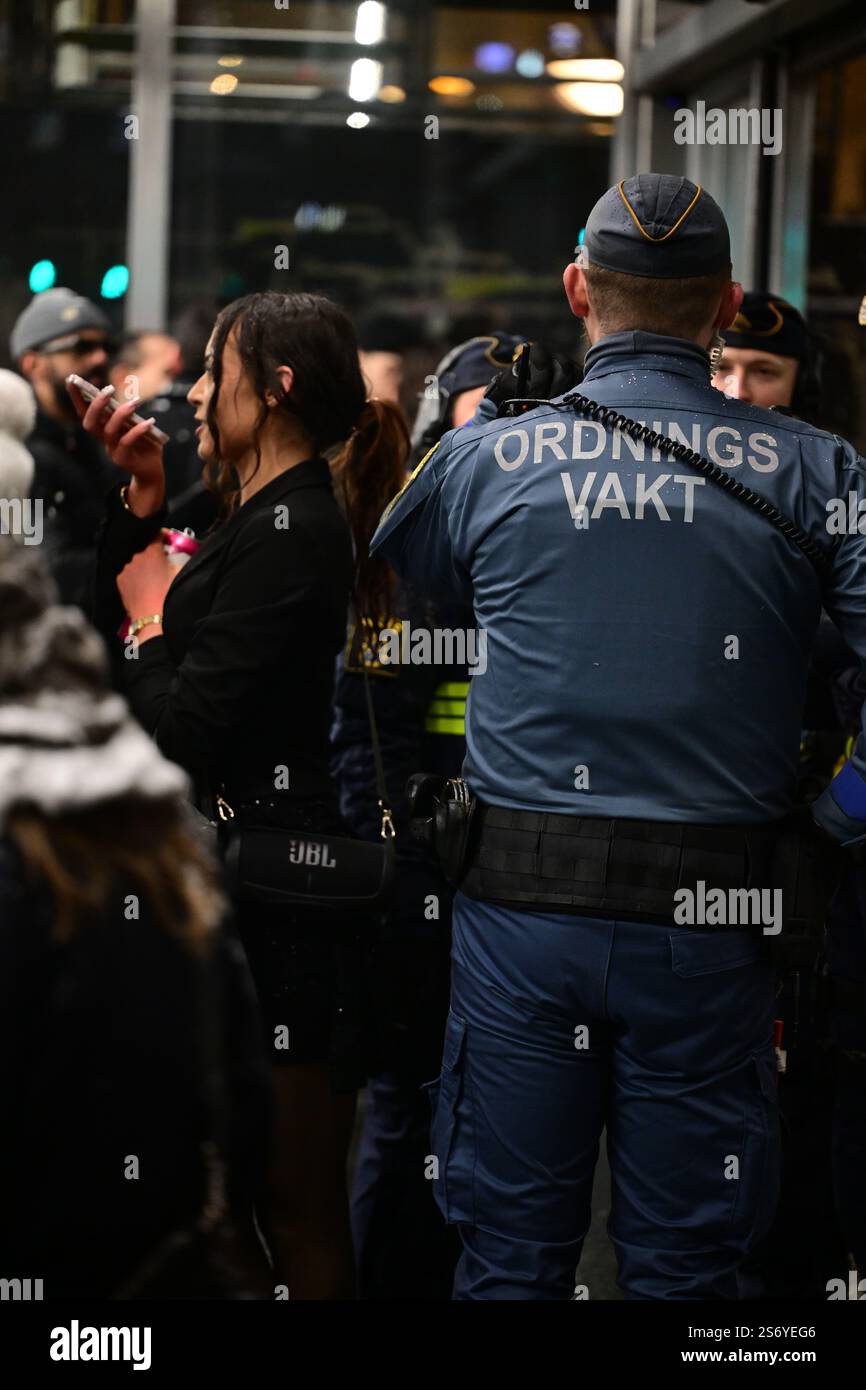 Stockholm, Uppland, Sweden. January 1 2025. Police and security guards ...