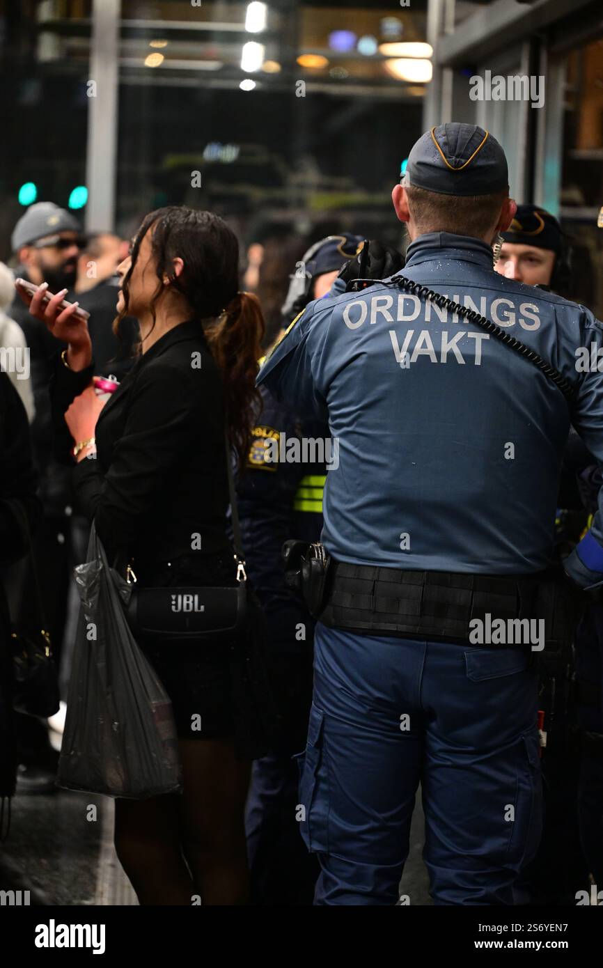 Stockholm, Uppland, Sweden. January 1 2025. Police and security guards ...