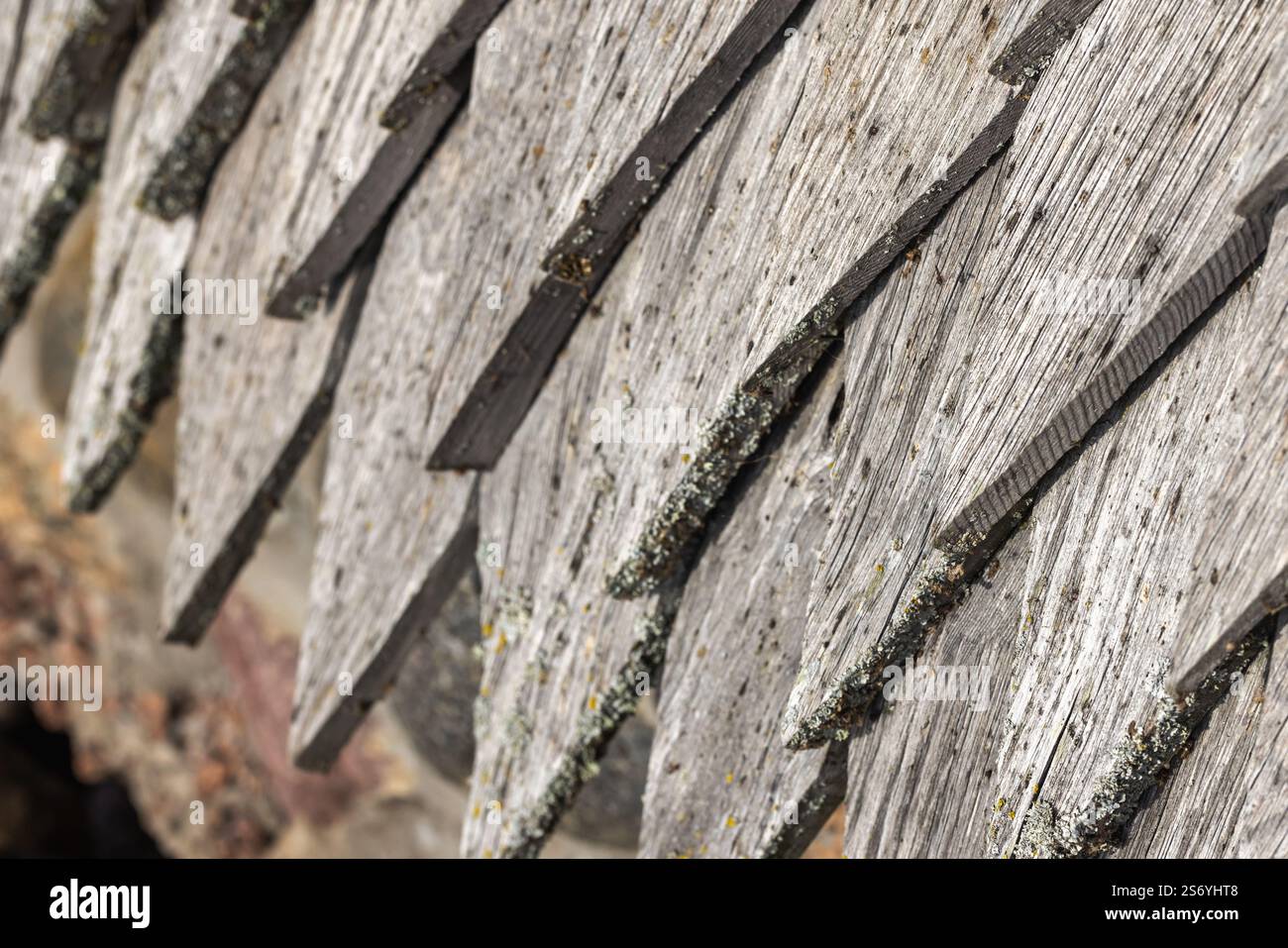 Details of an old weathered wooden roof, uncolored gray planks with ...