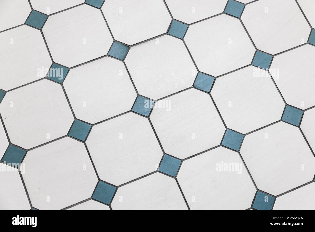 Vintage stone mosaic floor tiling with white and green squares pattern ...