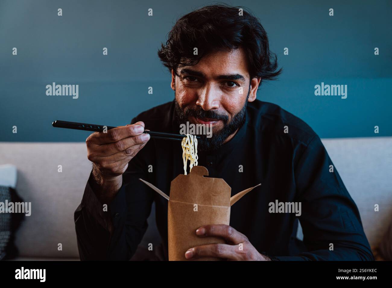 Pakistani guy with traditional outfit eating noodles Stock Photo - Alamy