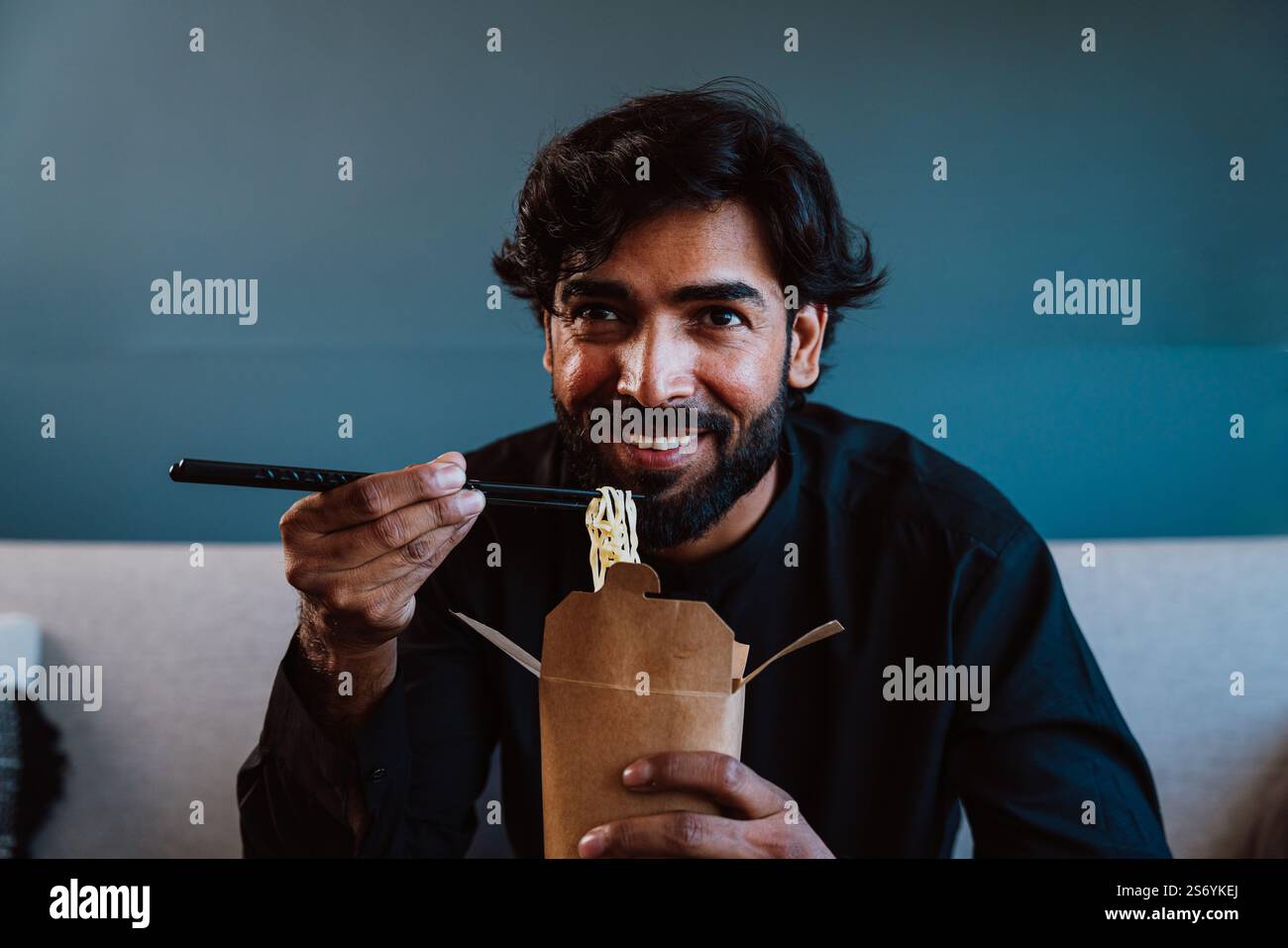 Pakistani guy with traditional outfit eating noodles Stock Photo - Alamy