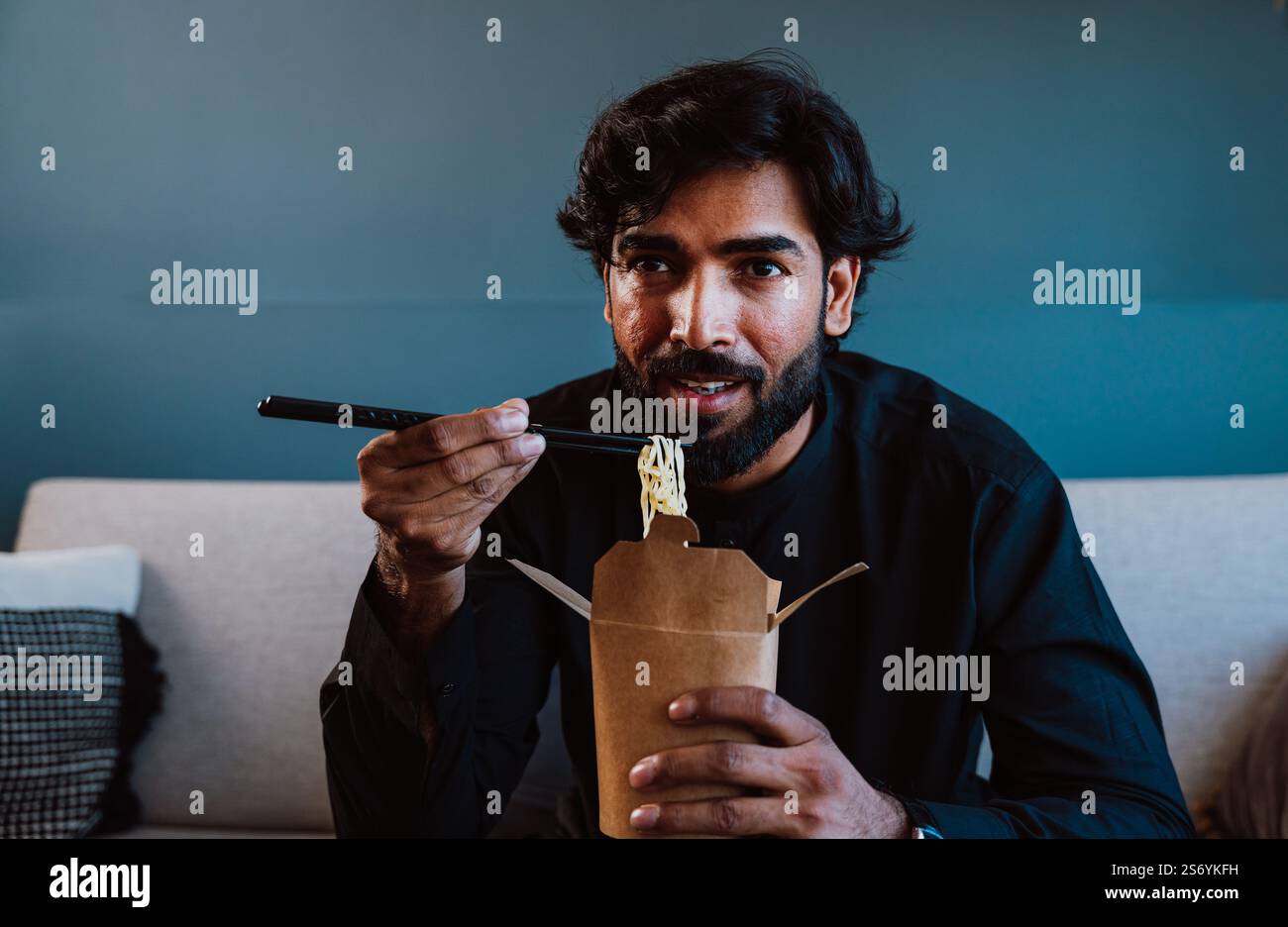 Pakistani guy with traditional outfit eating noodles Stock Photo - Alamy