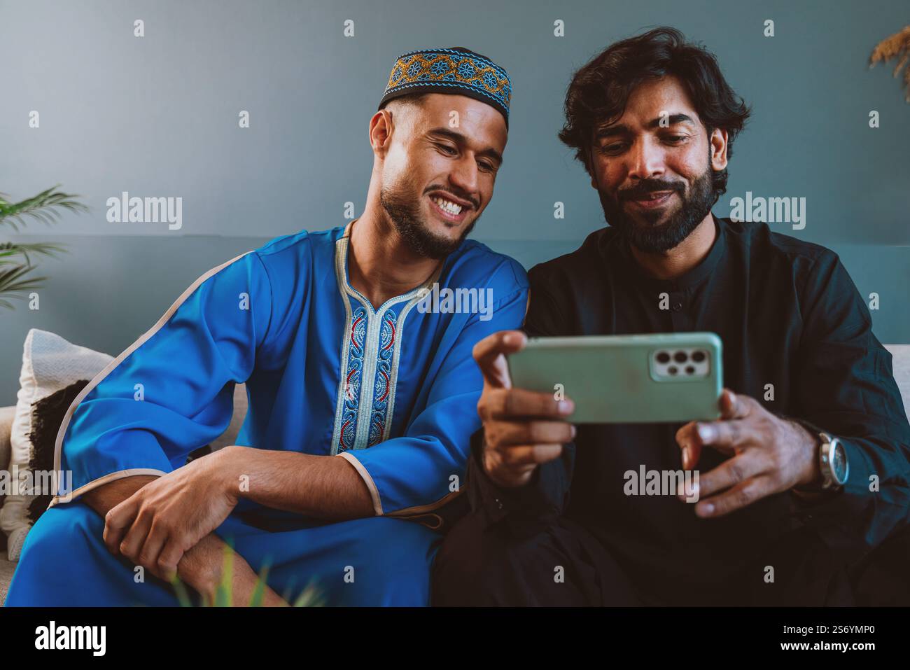 Friends watching funny memes on the smartphone and having fun laughing ...