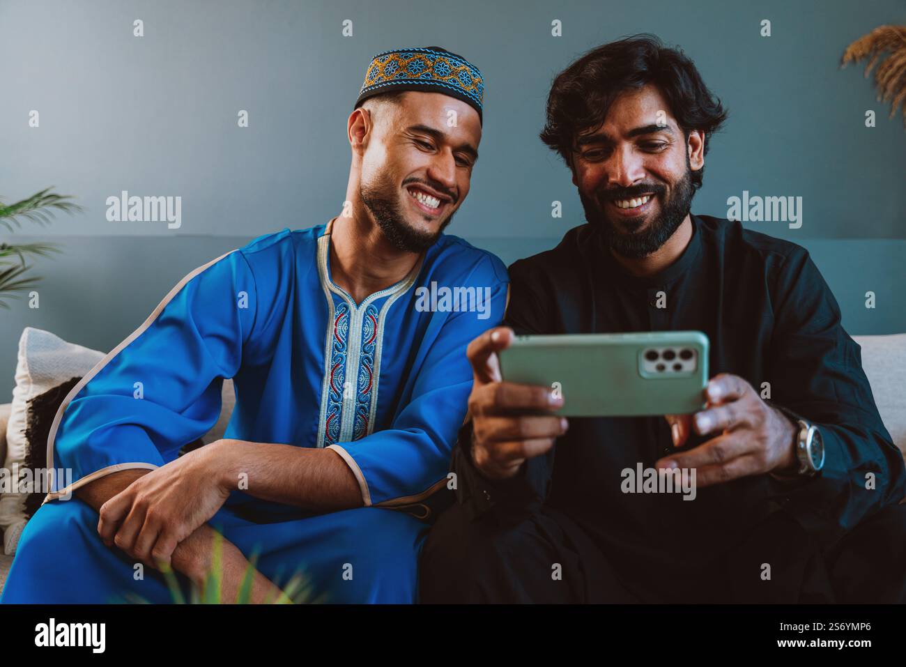 Friends watching funny memes on the smartphone and having fun laughing ...