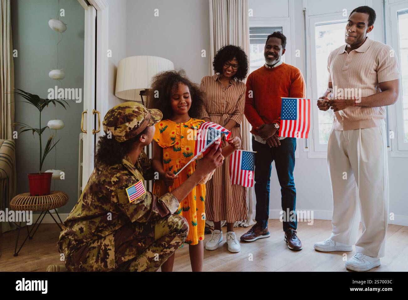 Us Veteran woman homecoming. Young woman coming back to her family from ...