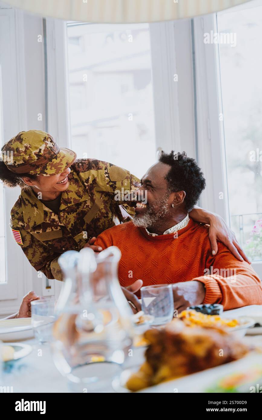 Us Veteran woman homecoming. Young woman coming back to her family from ...