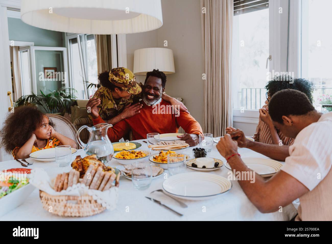 Us Veteran woman homecoming. Young woman coming back to her family from ...