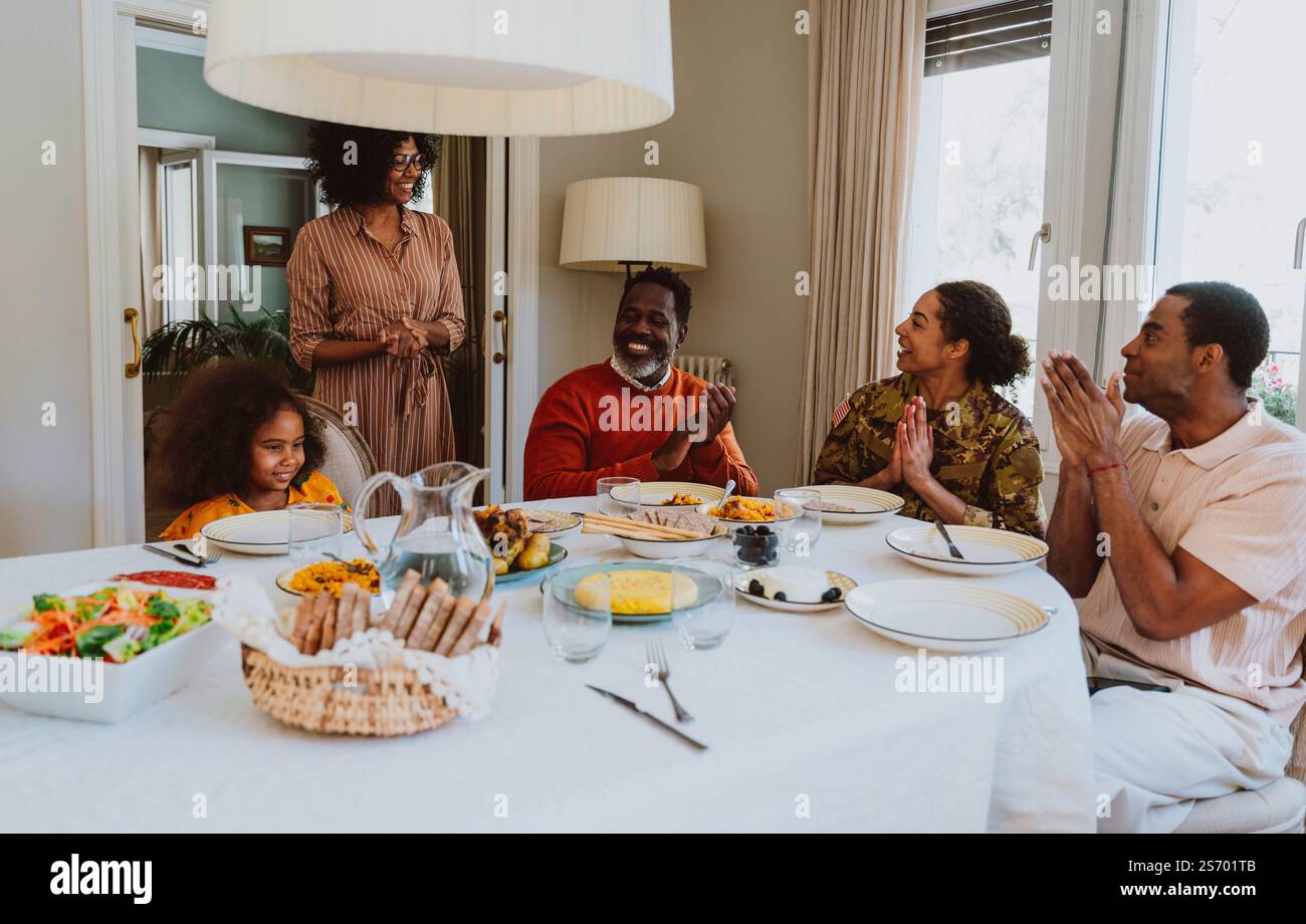 Us Veteran woman homecoming. Young woman coming back to her family from ...