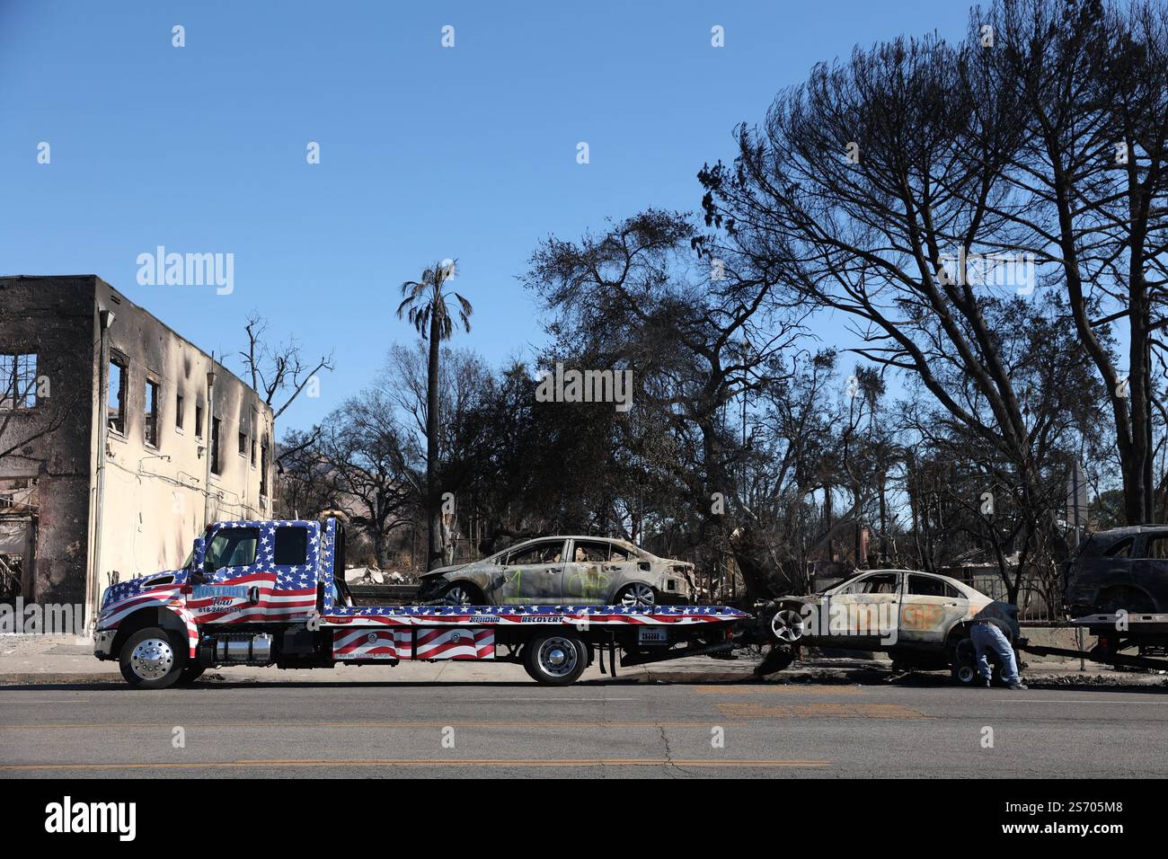 Los Angeles, United States. 16th Jan, 2025. A tow truck towing two ...